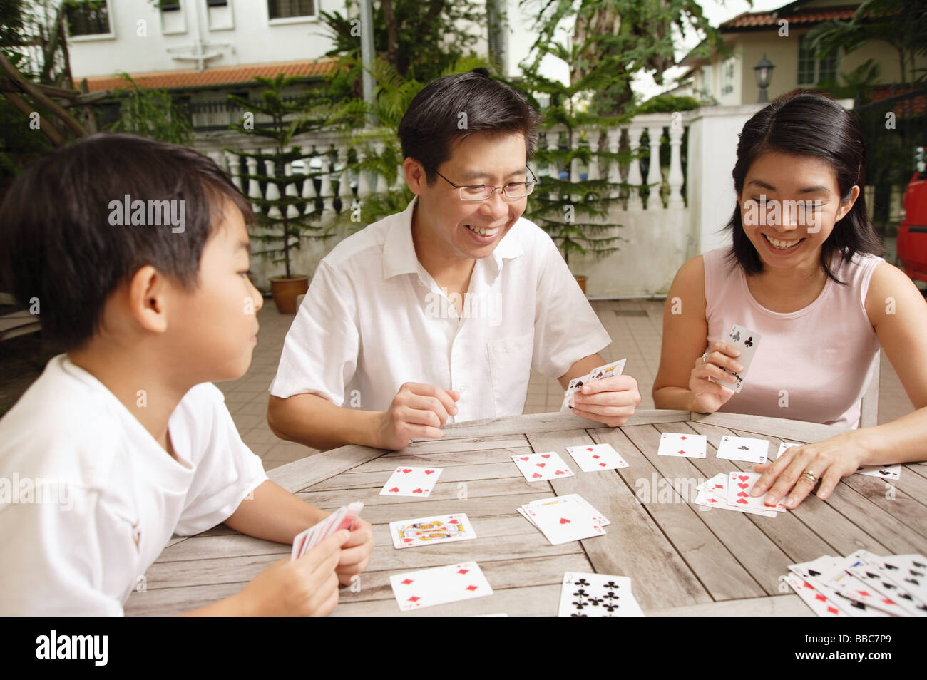 Family playing cards Stock Photo - Alamy