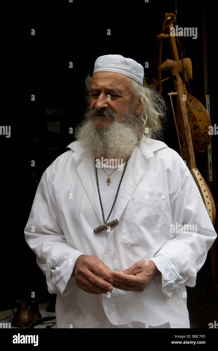 A Muslim Bosniak wearing traditional Bosnian clothing in the old city ...