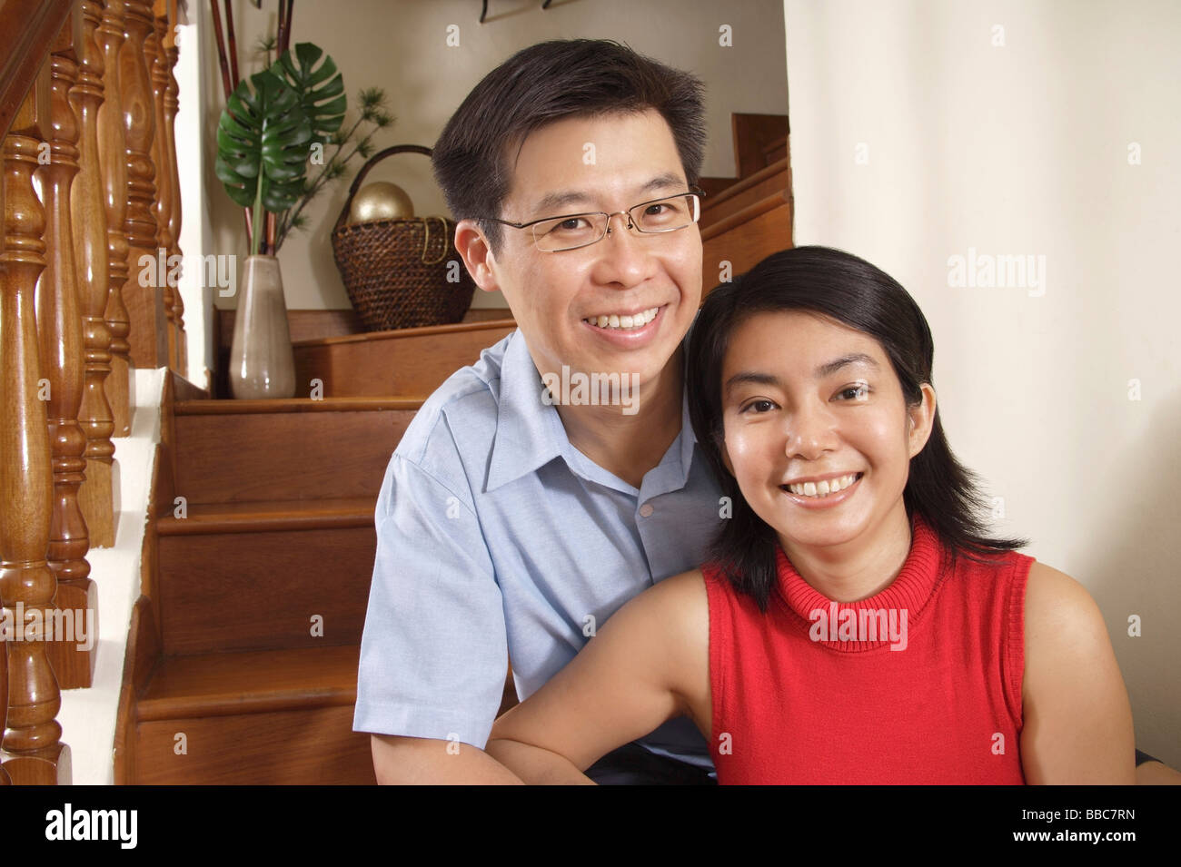 Couple smiling at camera Stock Photo - Alamy