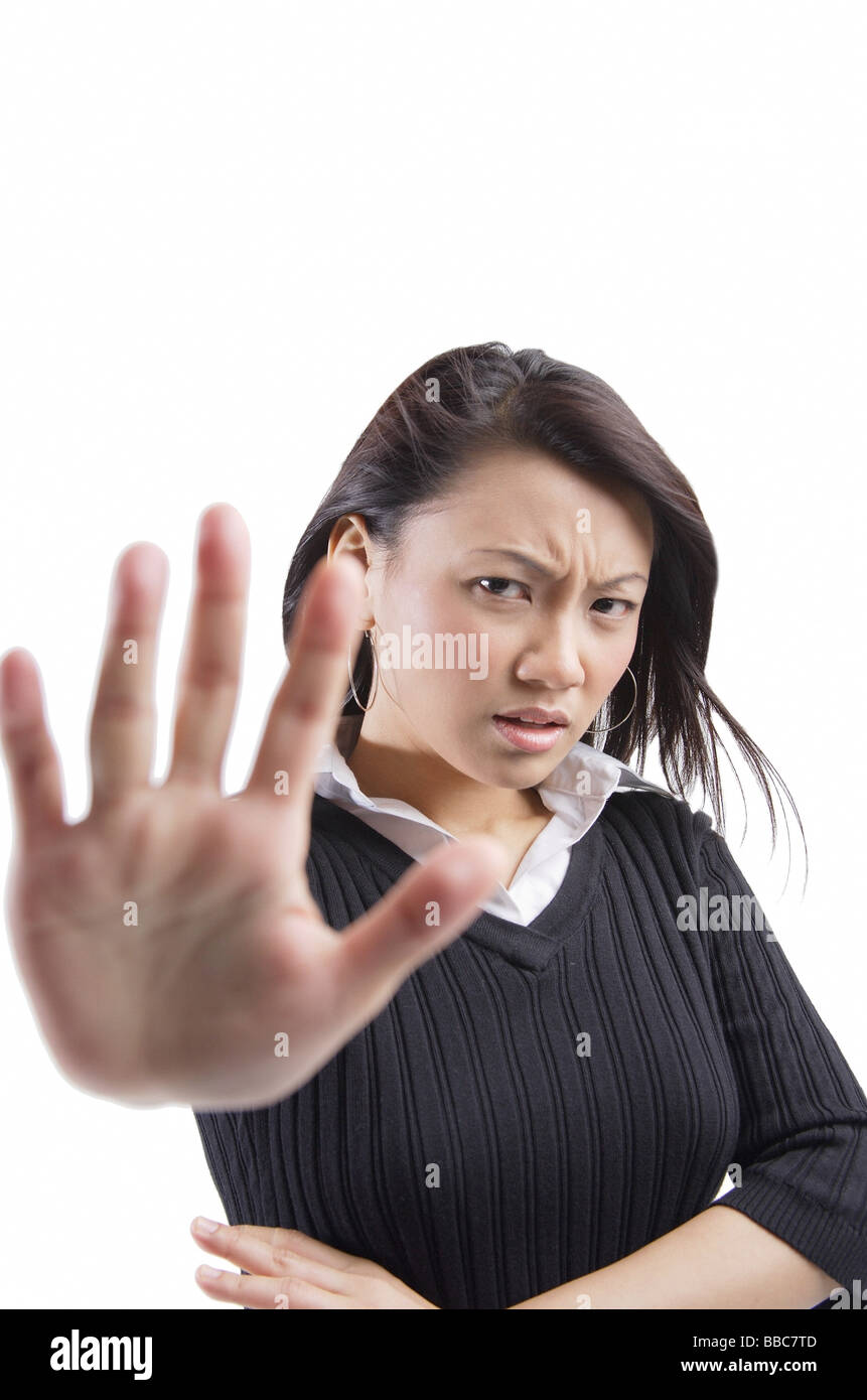 Young woman showing hand to camera Stock Photo - Alamy