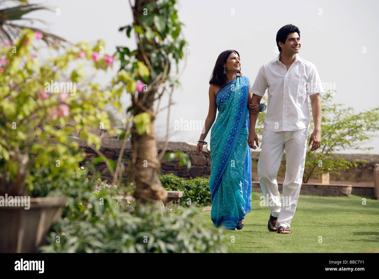 young couple strolling in garden Stock Photo - Alamy