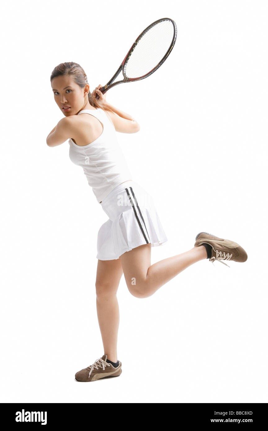 Young woman holding tennis racket Stock Photo - Alamy