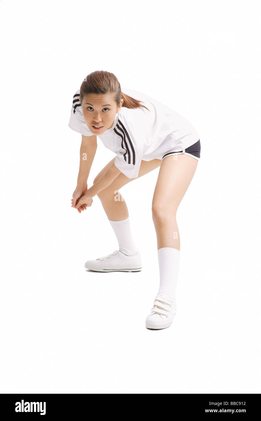 Vertical shot young woman bending Cut Out Stock Images & Pictures - Alamy