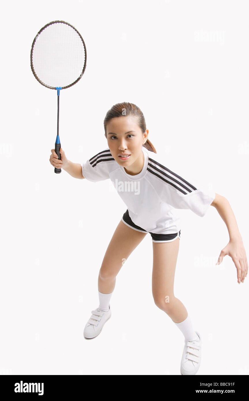 Young woman holding badminton racket Stock Photo - Alamy