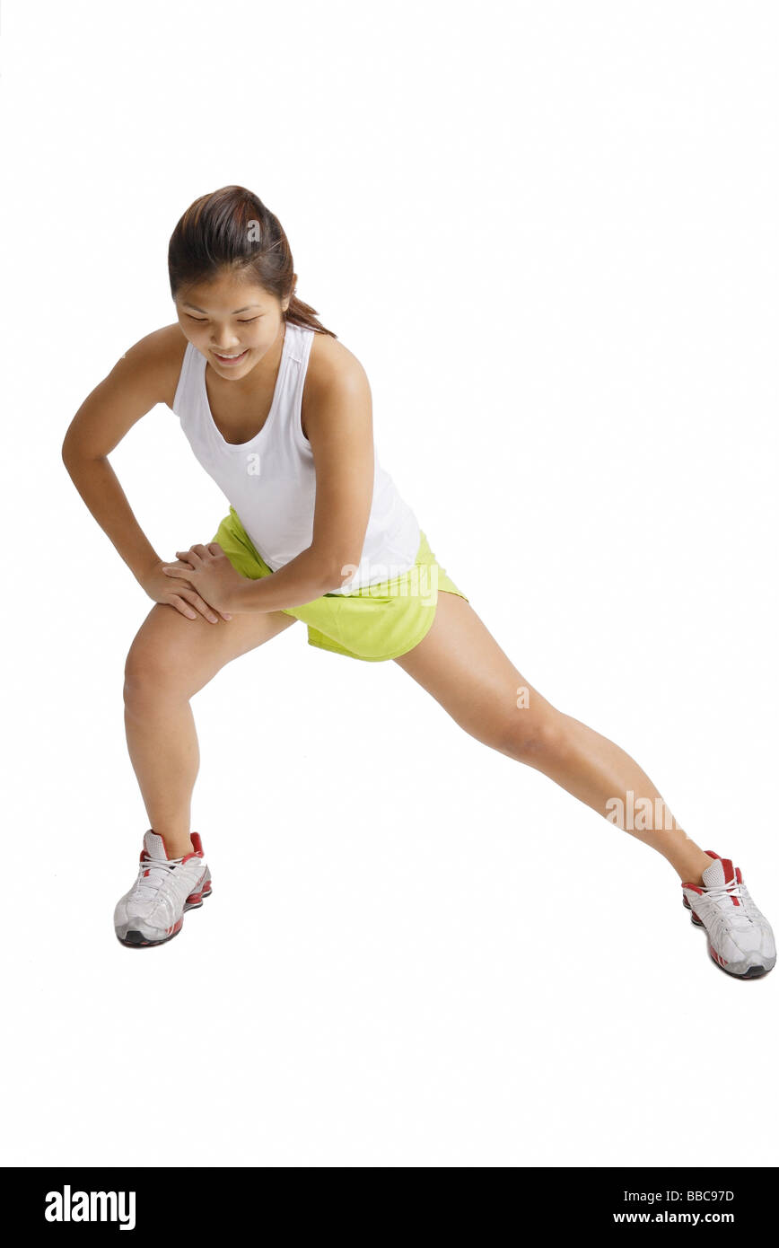 Woman stretching doing exercises on Cut Out Stock Images & Pictures - Alamy
