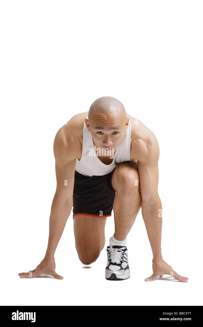 Young man in starting position Stock Photo - Alamy