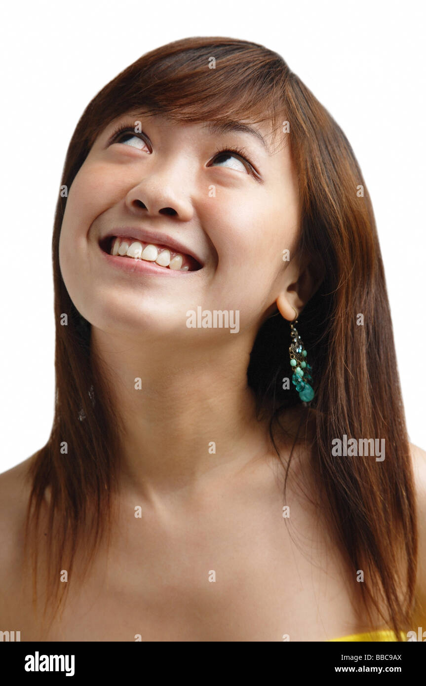 Young woman looking up, head shot Stock Photo - Alamy