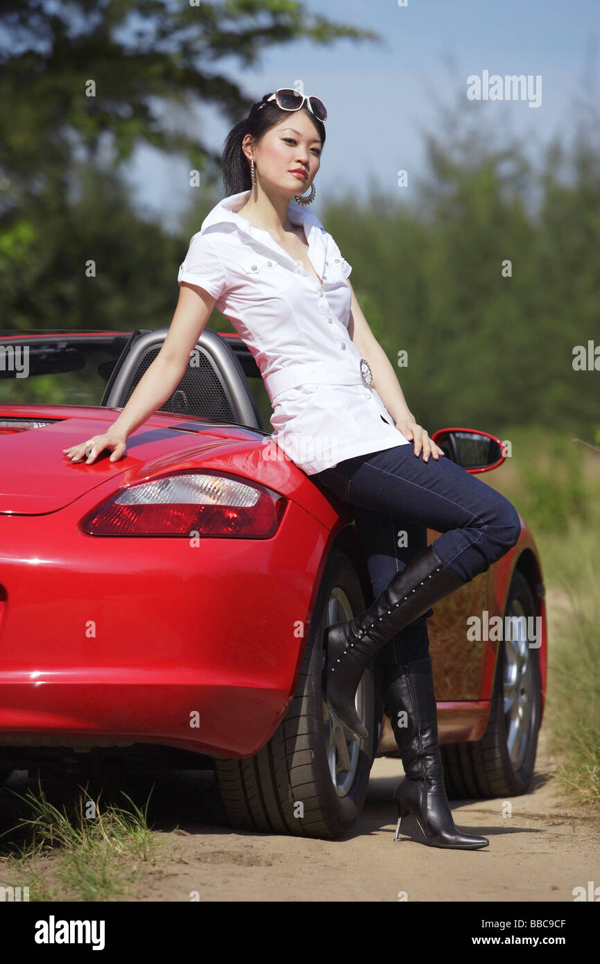 Black woman leaning on convertible hi-res stock photography and images ...