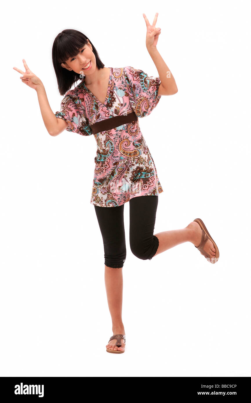 Young woman making hand sign Stock Photo - Alamy