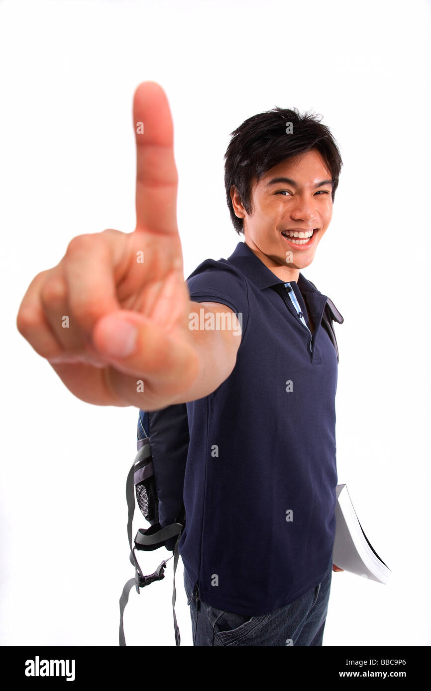 Young man making hand sign Stock Photo - Alamy