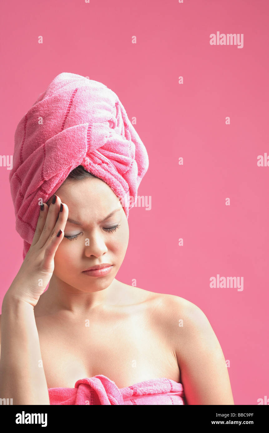 Woman wearing pink turban, frowning, eyes closed Stock Photo - Alamy