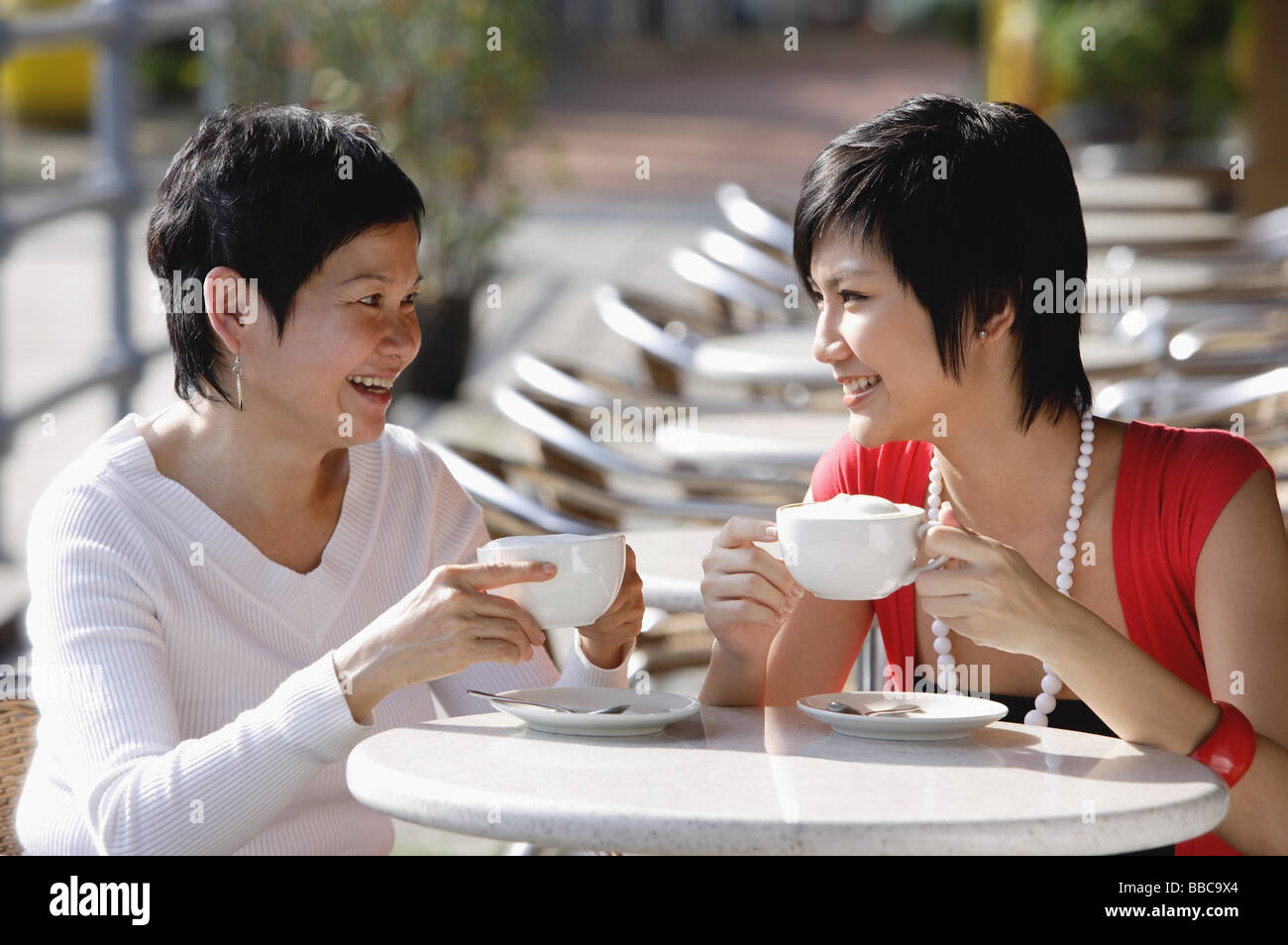 Two women in cafe having a drink Stock Photo - Alamy