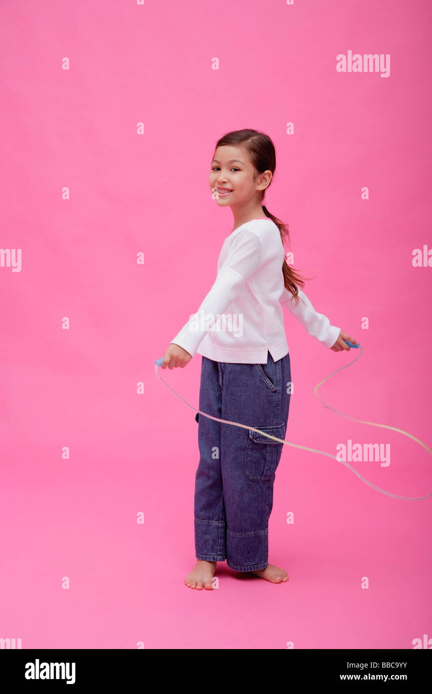 Girl with skipping rope Stock Photo - Alamy