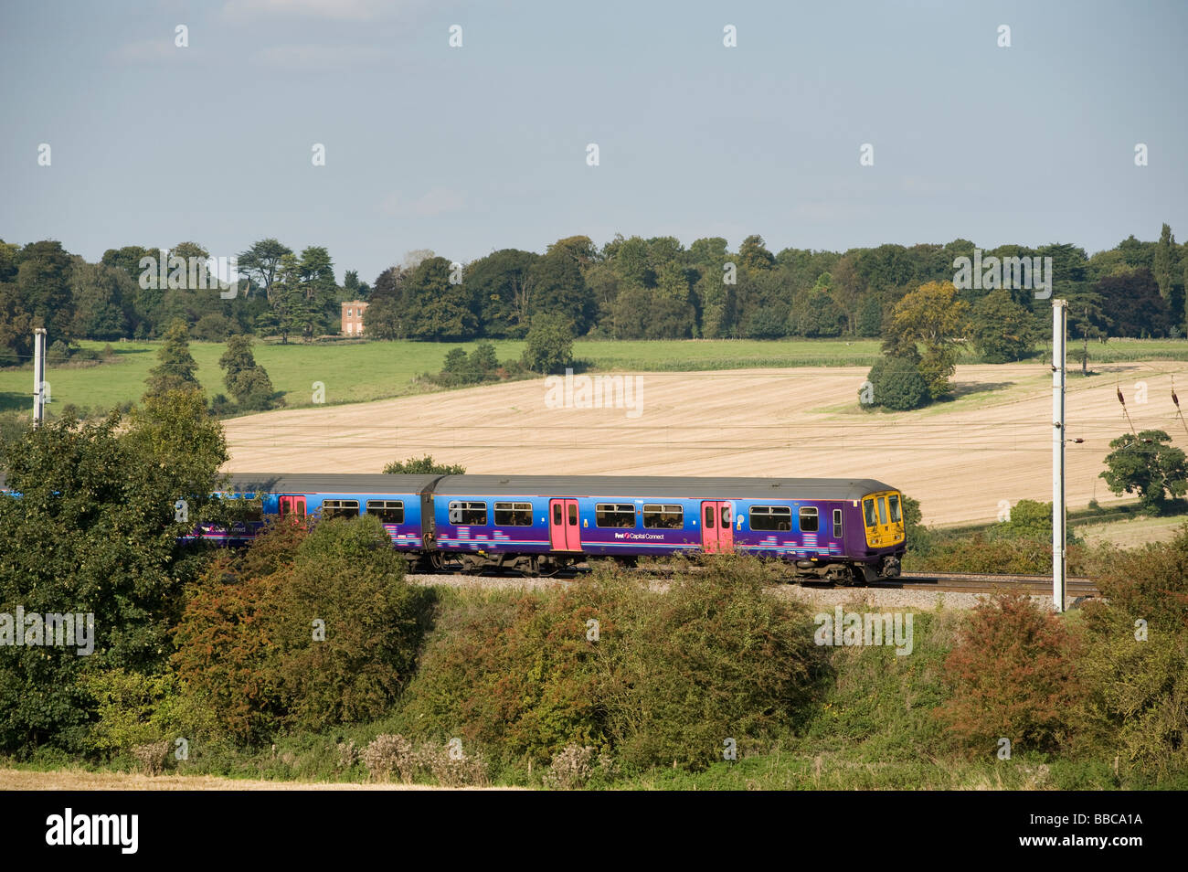 Passenger train in First Capital Connect livery speeding through the ...