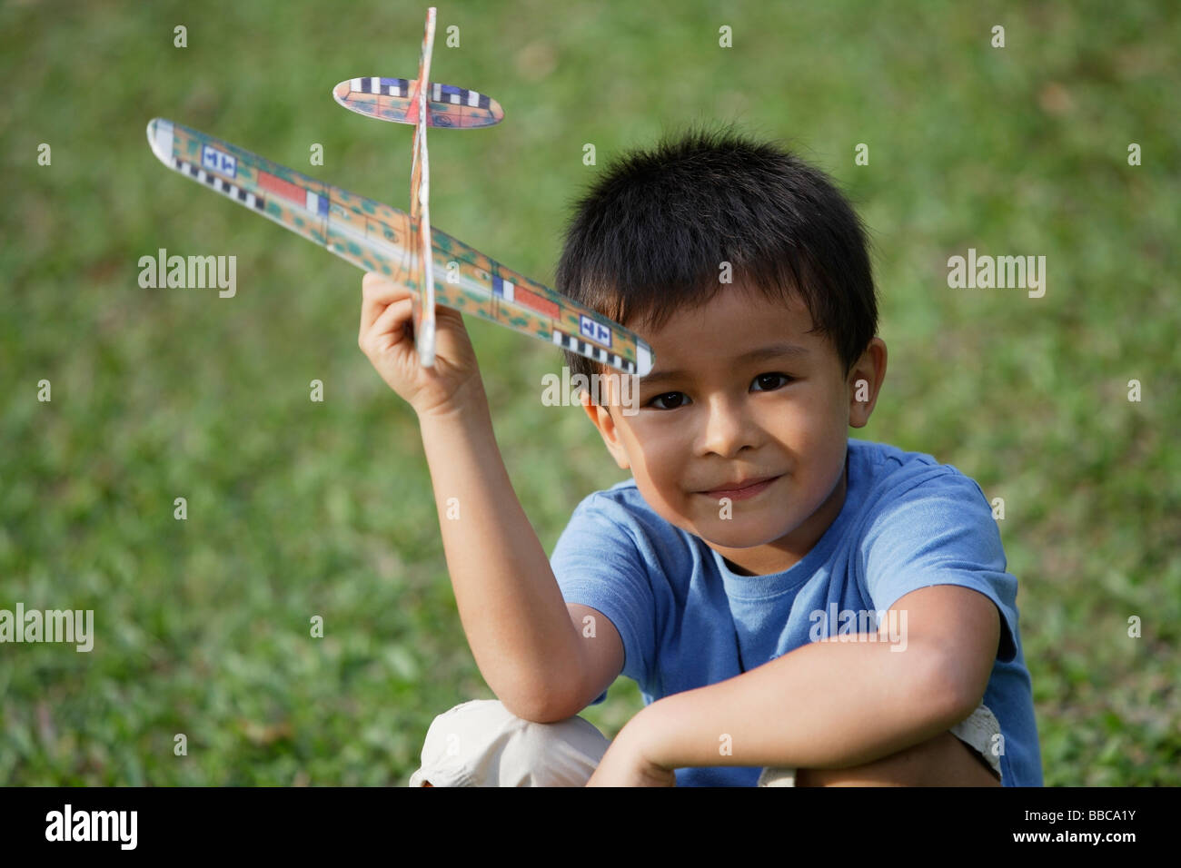 boy holding toy airplane Stock Photo - Alamy