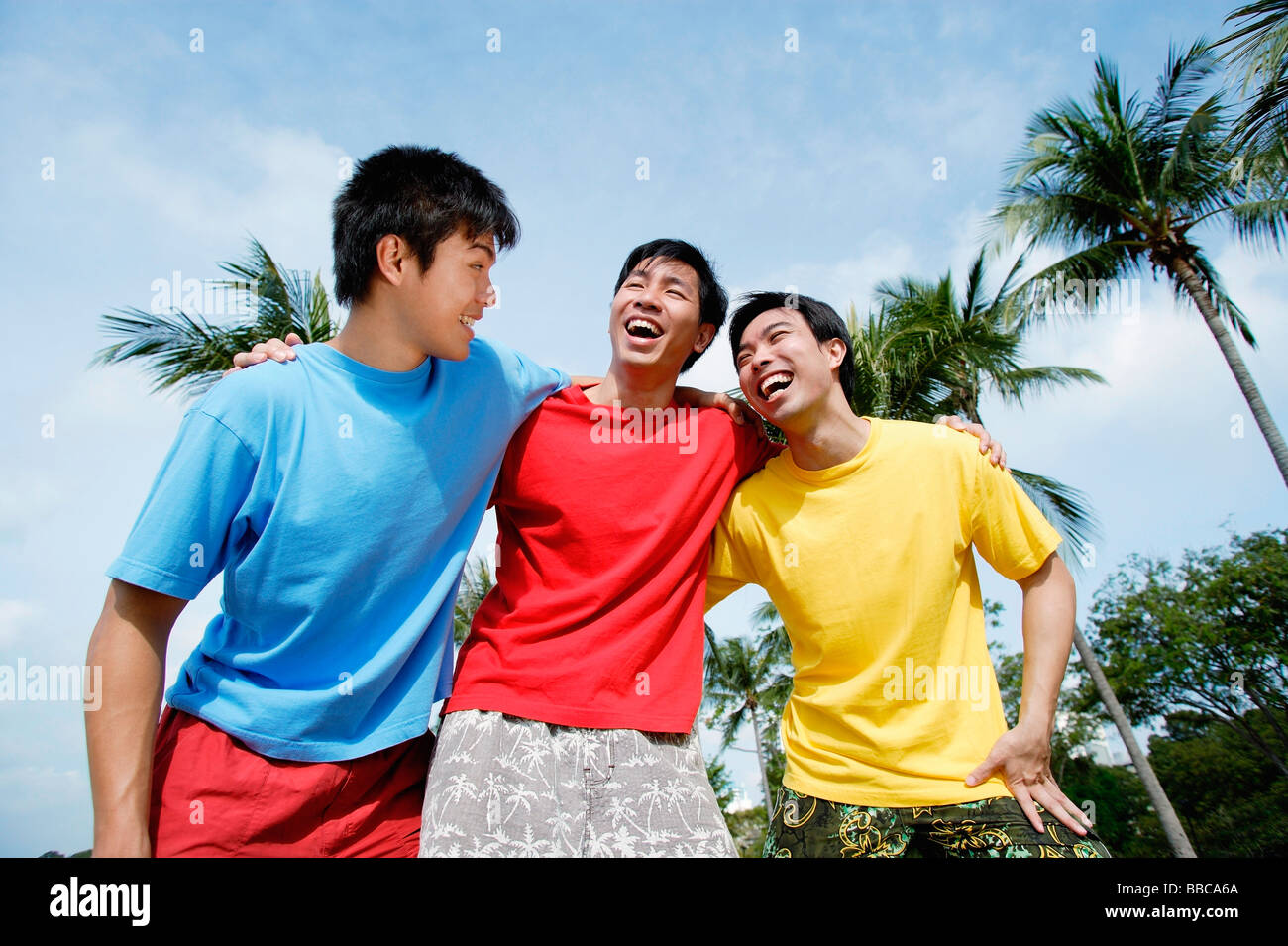 Men with arms around each other Stock Photo - Alamy