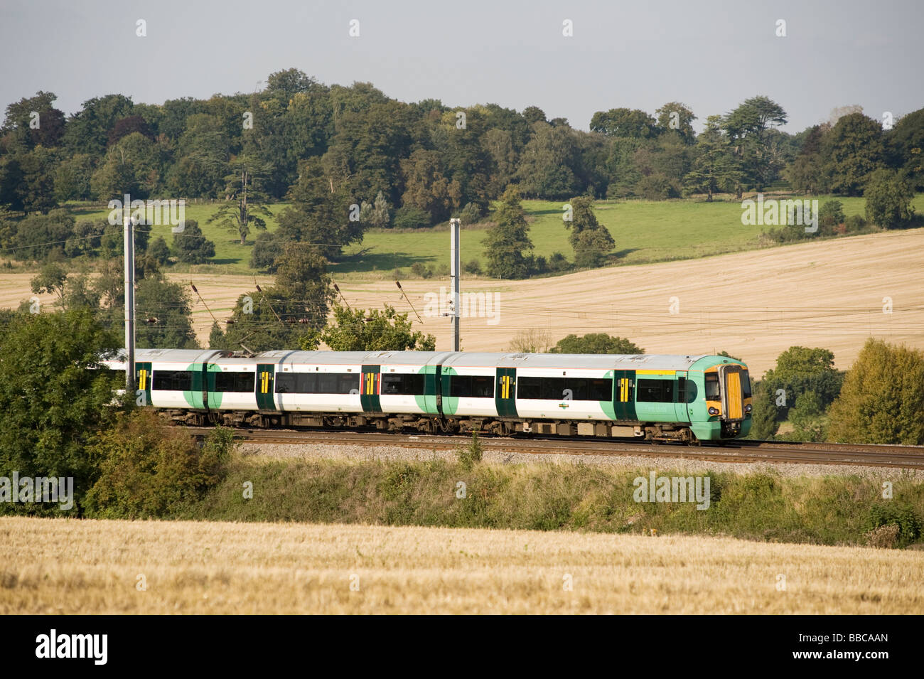 Passenger train in Southern livery speeding through the English ...