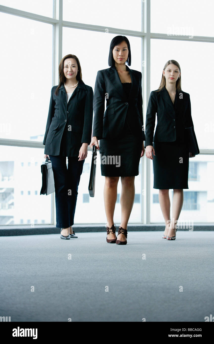 Three businesswomen, walking towards camera Stock Photo - Alamy