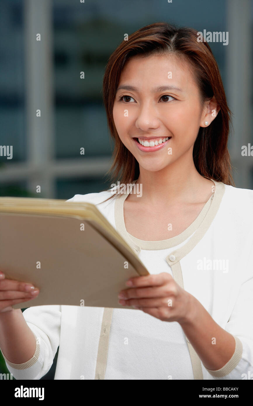 Vertical asian secretary businesswoman holding hi-res stock photography ...