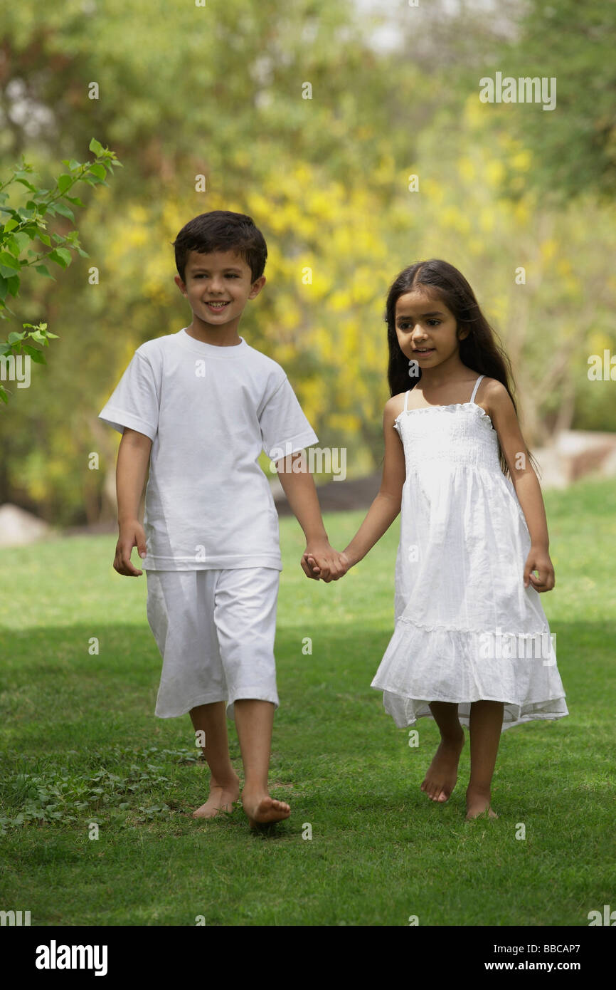 two children holding hands Stock Photo - Alamy