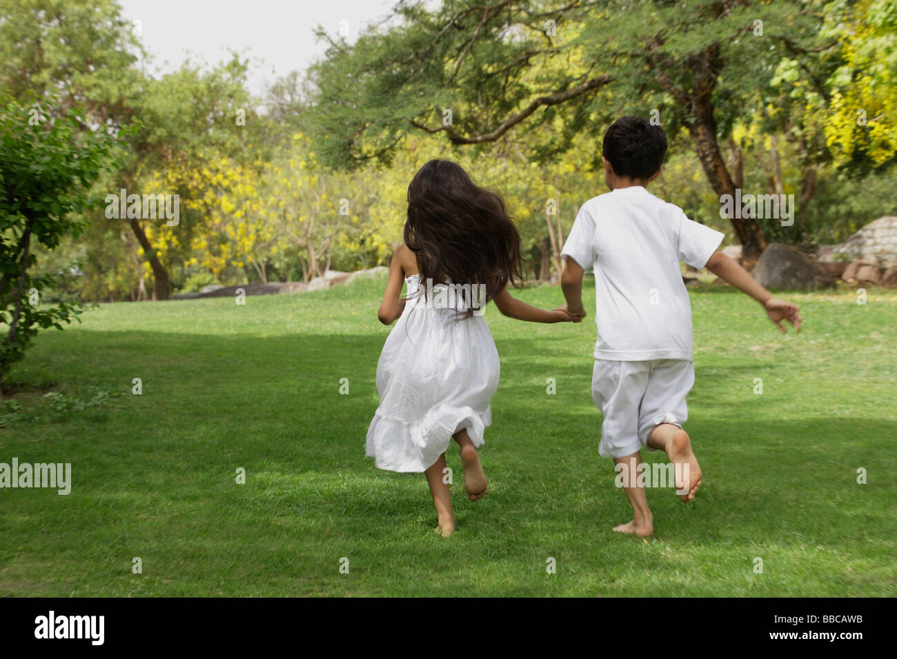 two little children running away Stock Photo - Alamy
