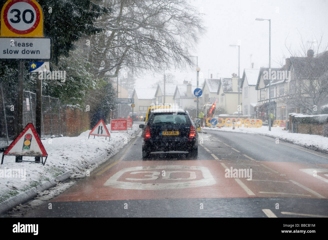 Drivers eye view through a car windscreen of traffic queuing at ...