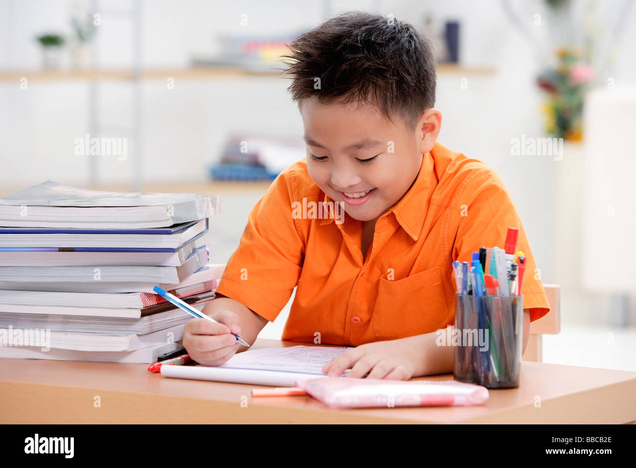 Boy doing homework Stock Photo - Alamy