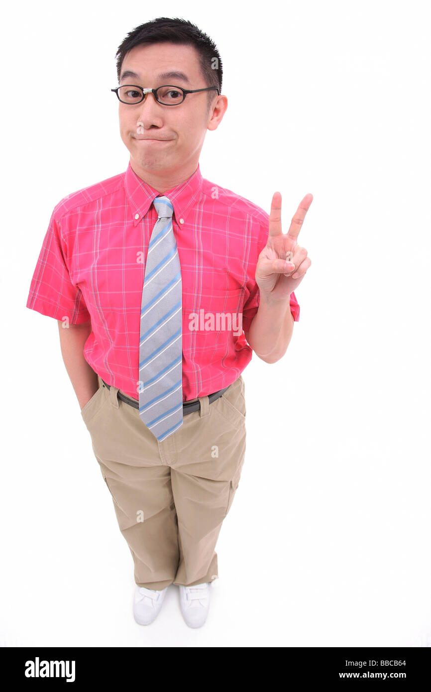 Man making peace sign, smiling at camera Stock Photo - Alamy