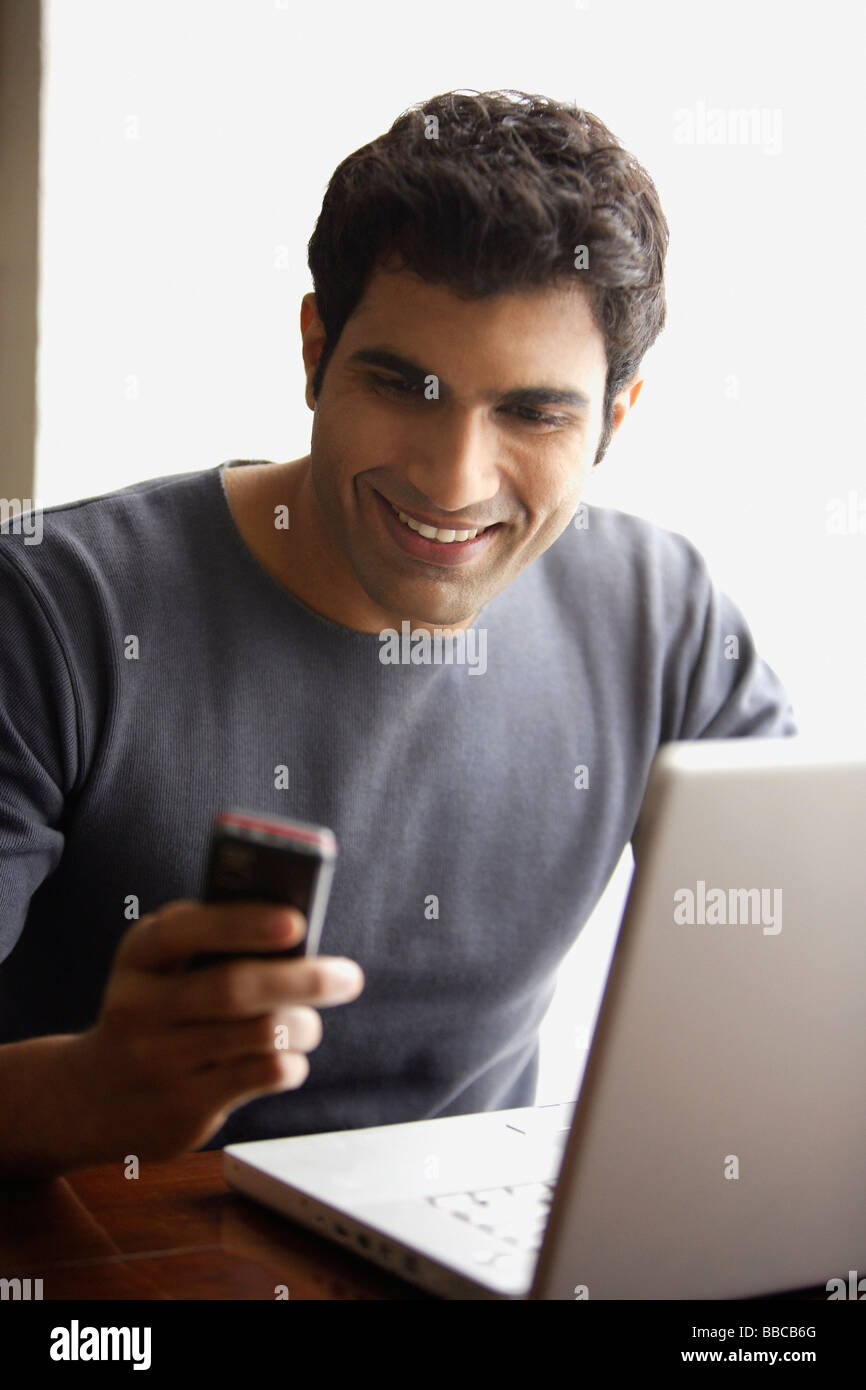 man looking at text messages Stock Photo - Alamy