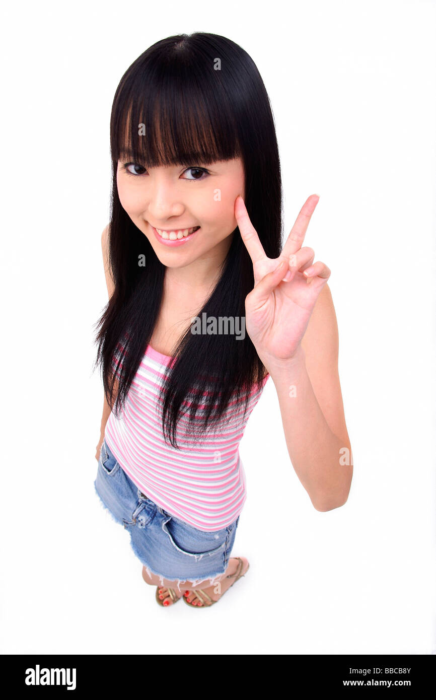 Asian women with peace sign Cut Out Stock Images & Pictures - Alamy