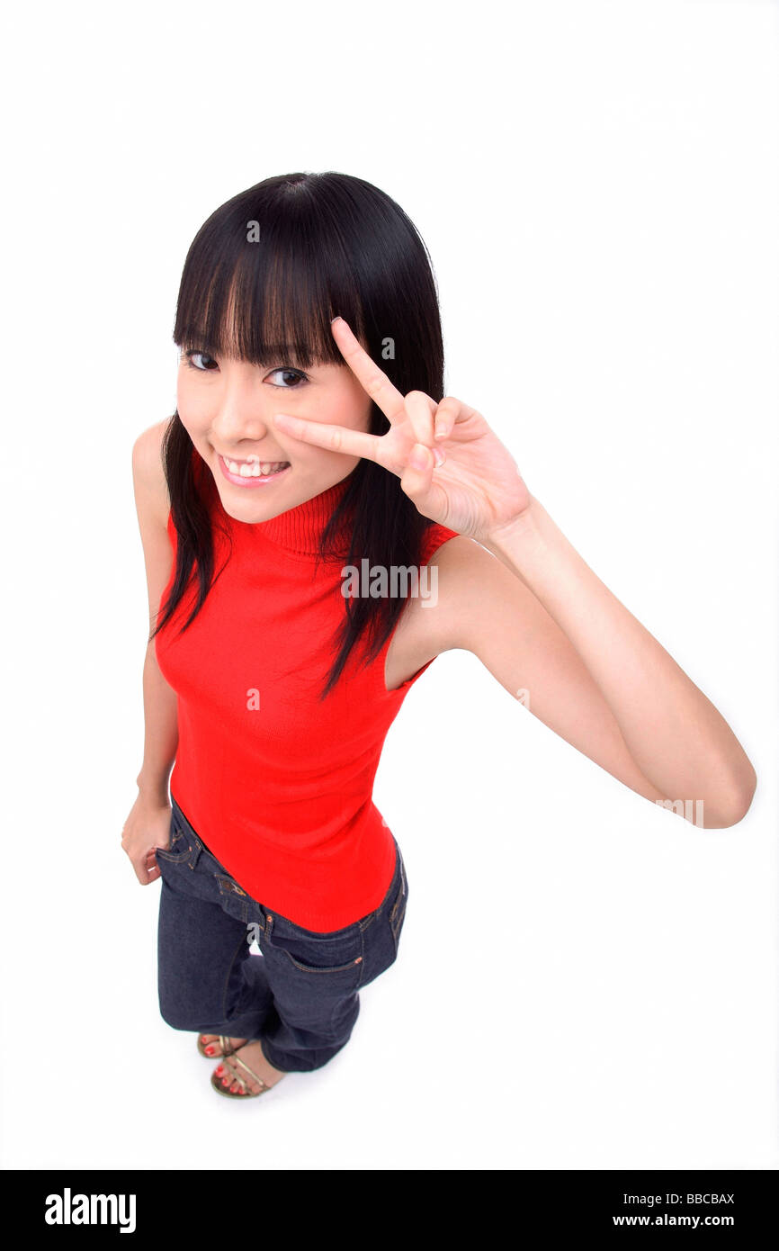 Asian women with peace sign Cut Out Stock Images & Pictures - Alamy