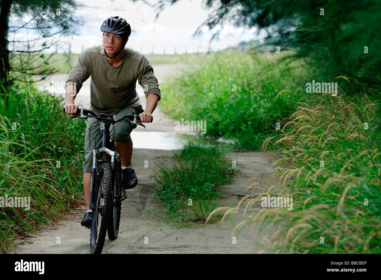 Man cycling on nature path Stock Photo - Alamy