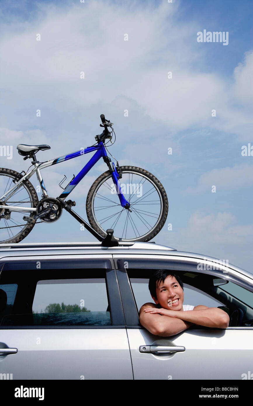 Man leaning out of car window hi-res stock photography and images - Alamy