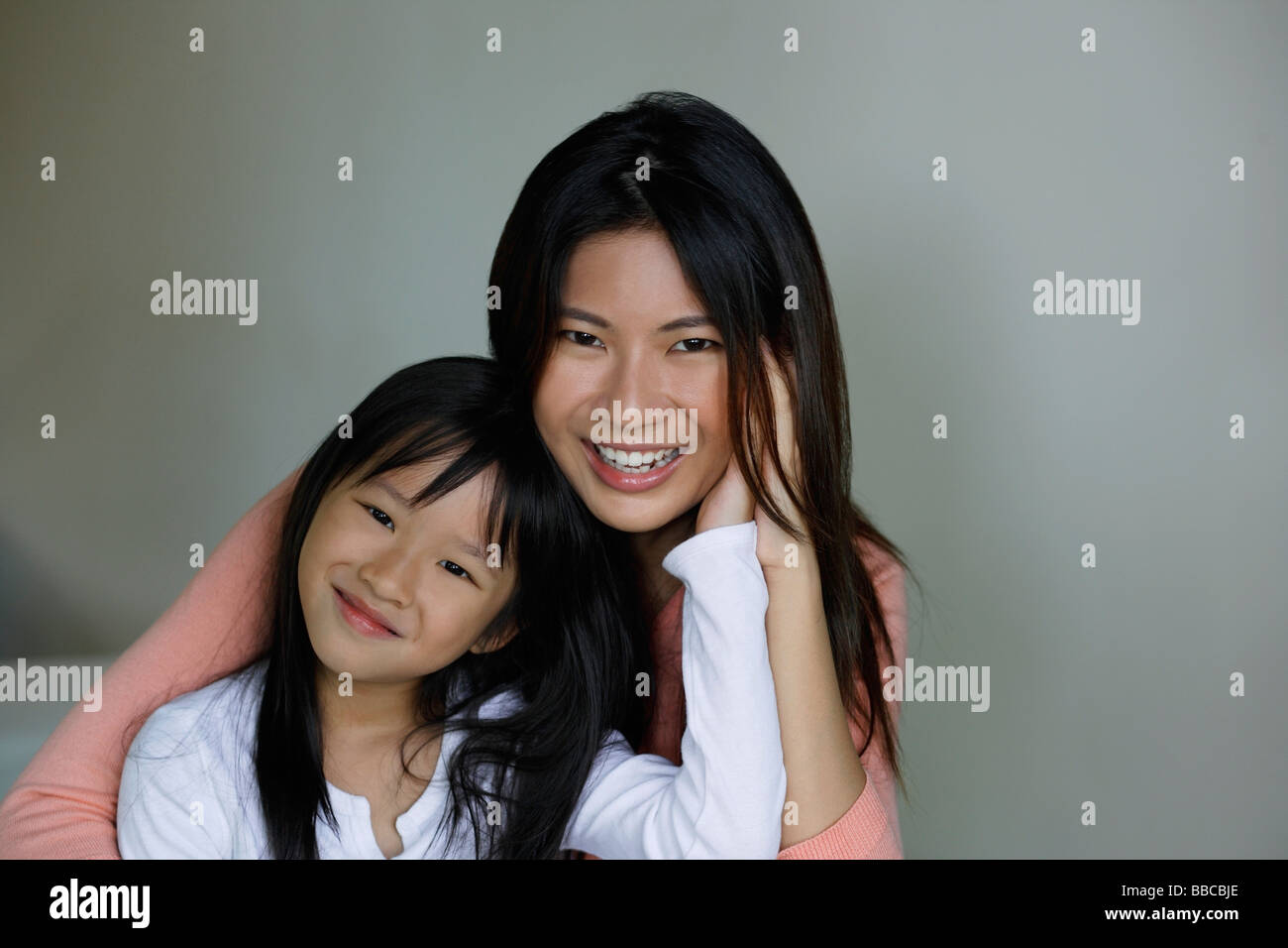 Mother and daughter embracing Stock Photo - Alamy