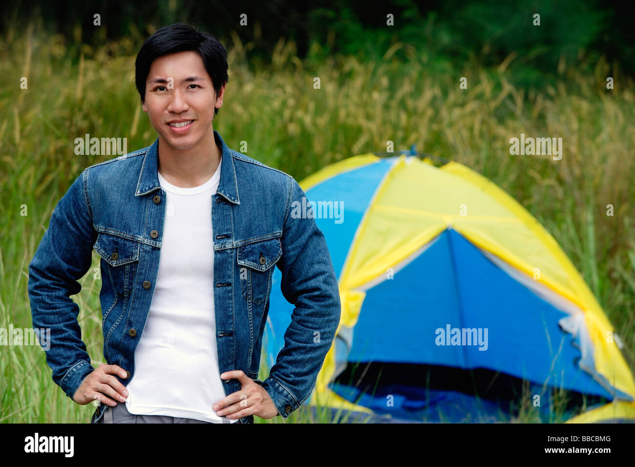 Man with tent in the background, portrait Stock Photo - Alamy