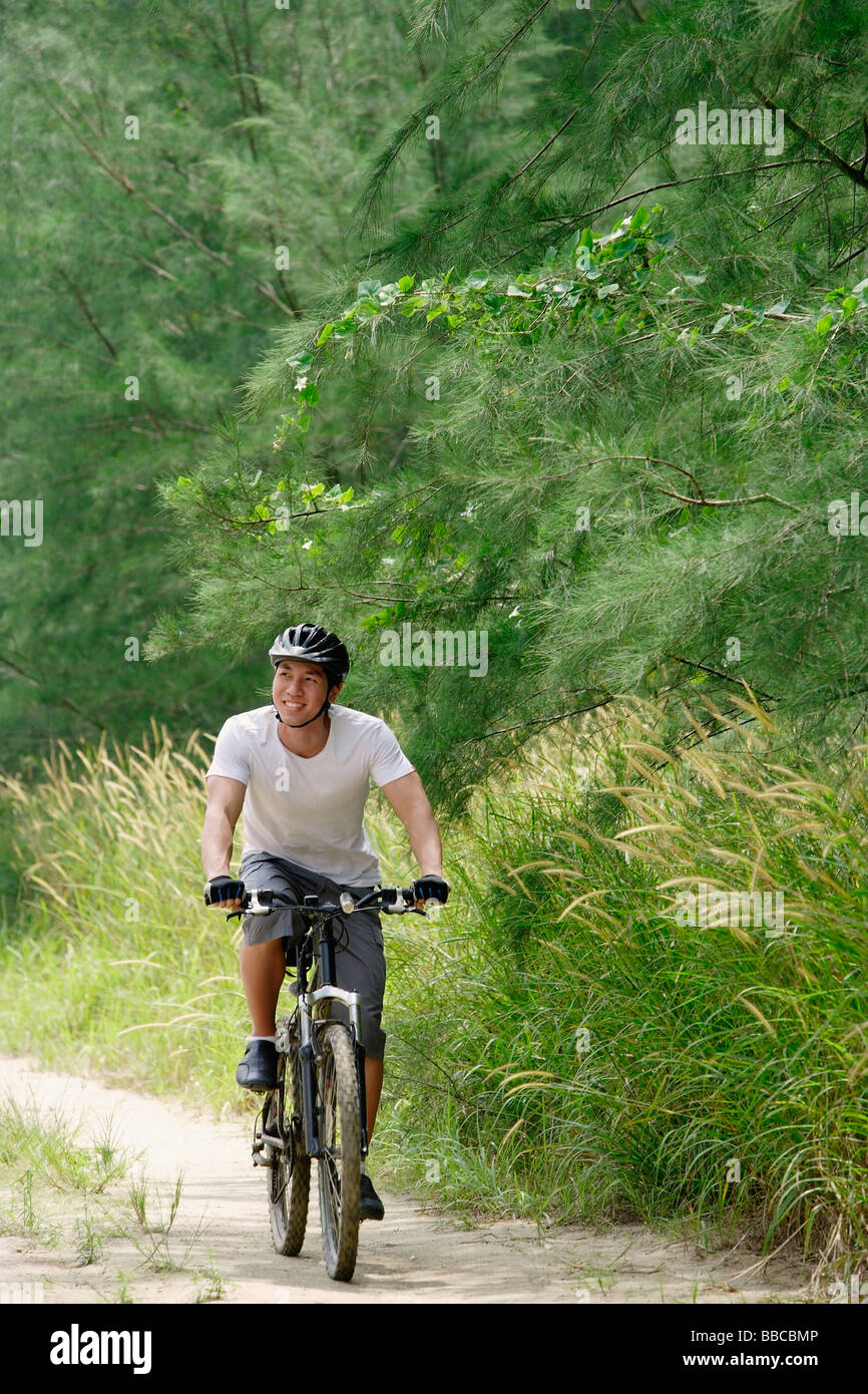 Man cycling on nature path Stock Photo - Alamy