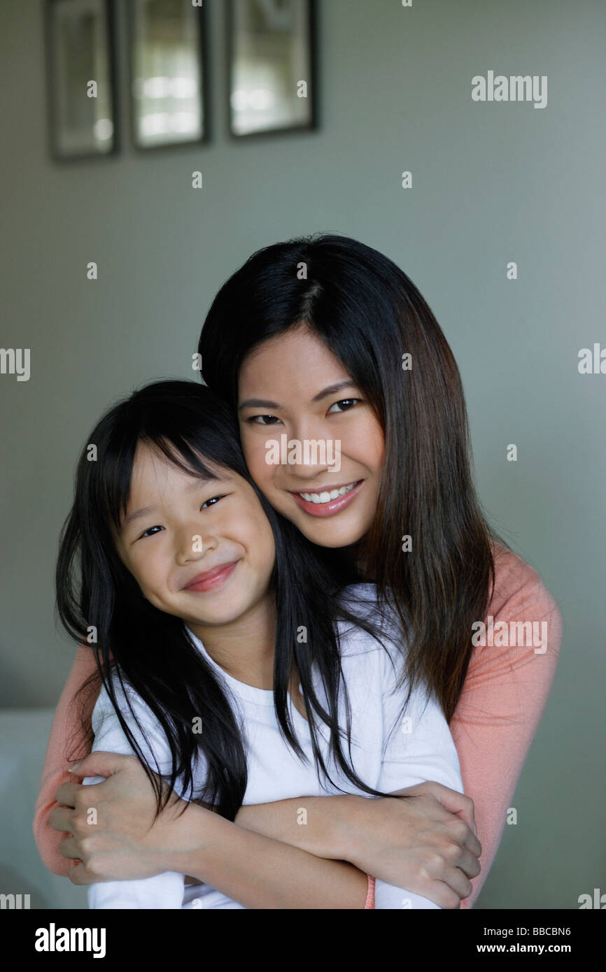 Mother and daughter embracing Stock Photo - Alamy