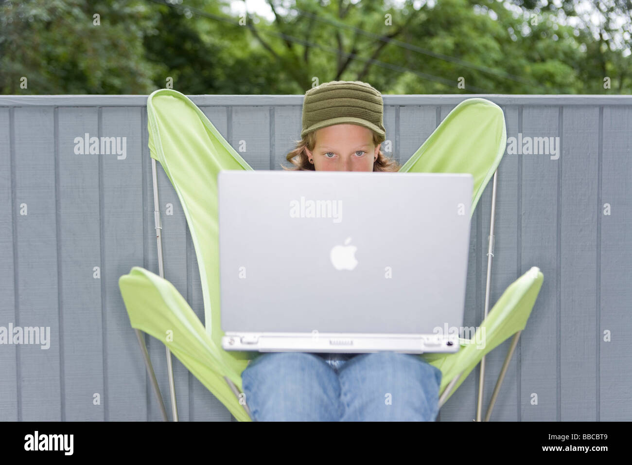 Girl on lap top computer Stock Photo - Alamy