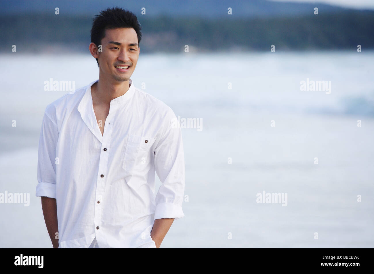 Man standing, smiling, portrait Stock Photo - Alamy