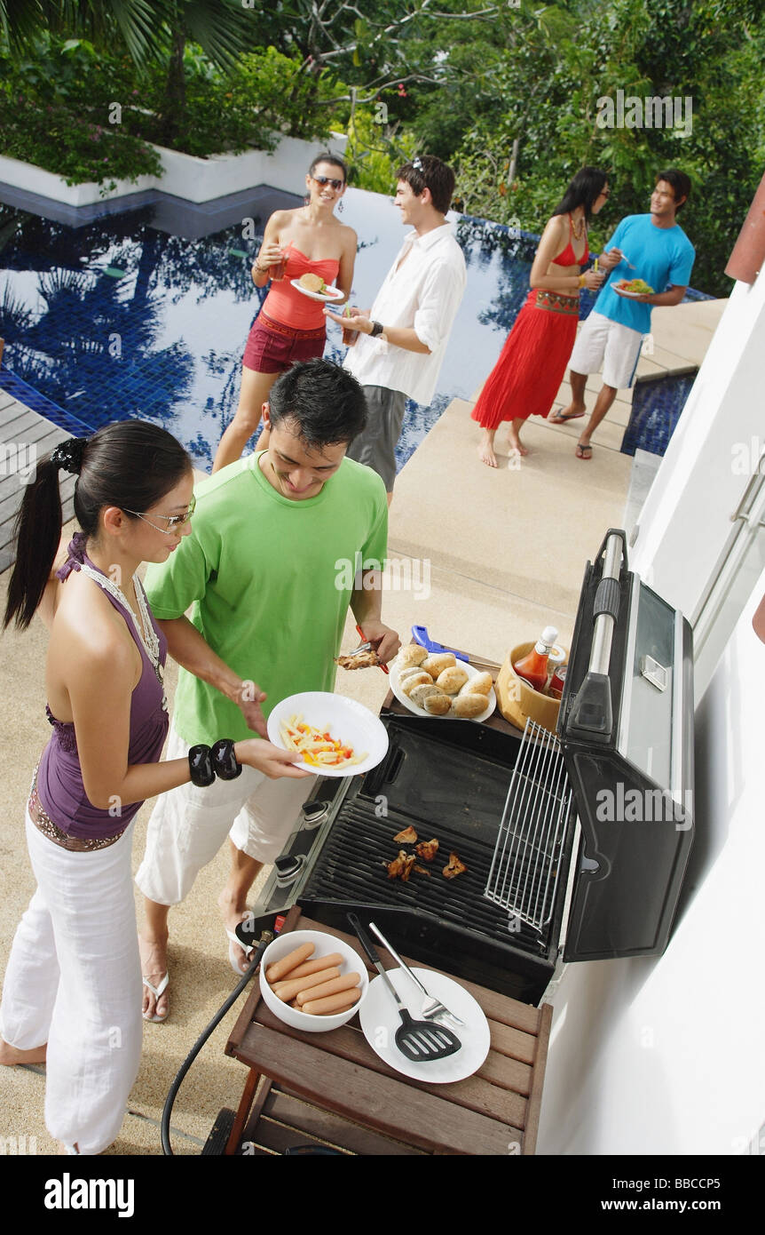 Friends at barbeque party Stock Photo - Alamy