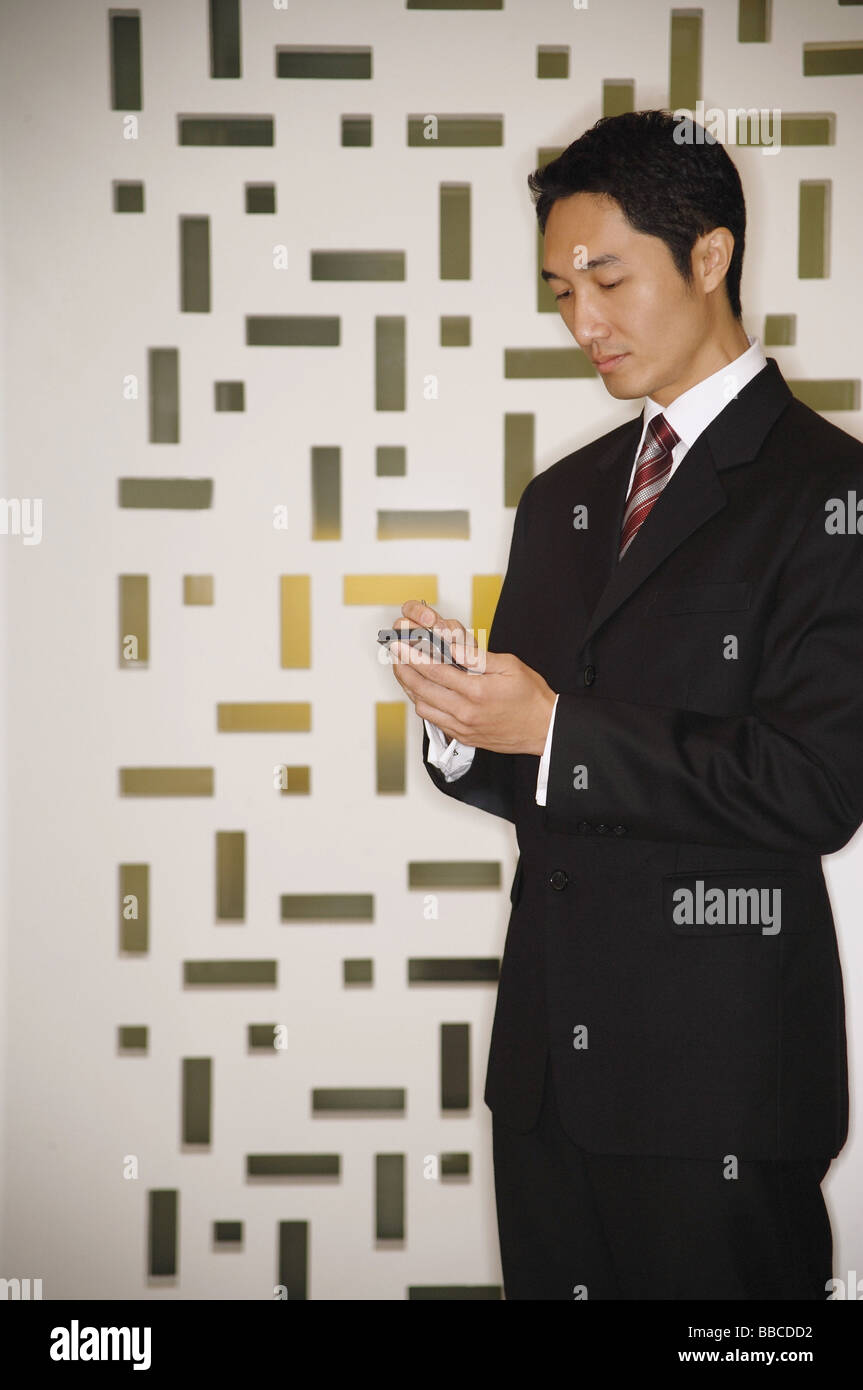 Businessman using PDA Stock Photo - Alamy