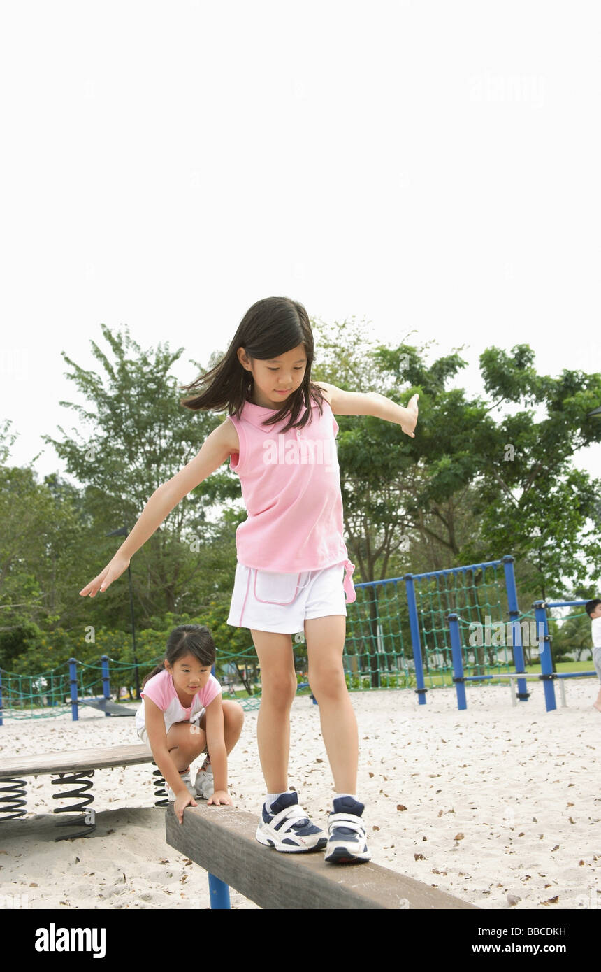 Girls walking on balance beams Stock Photo - Alamy