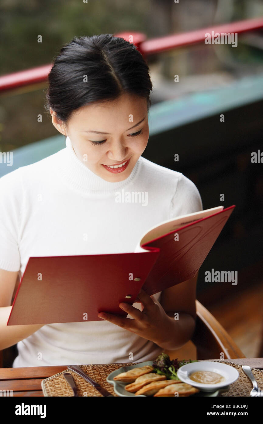 Women in cafe, reading menu Stock Photo - Alamy