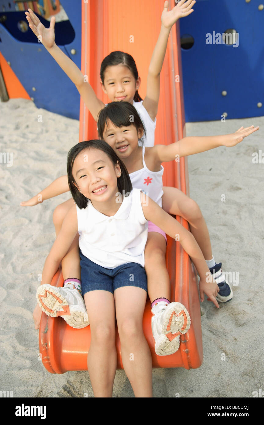 Girls on a slide Stock Photo - Alamy