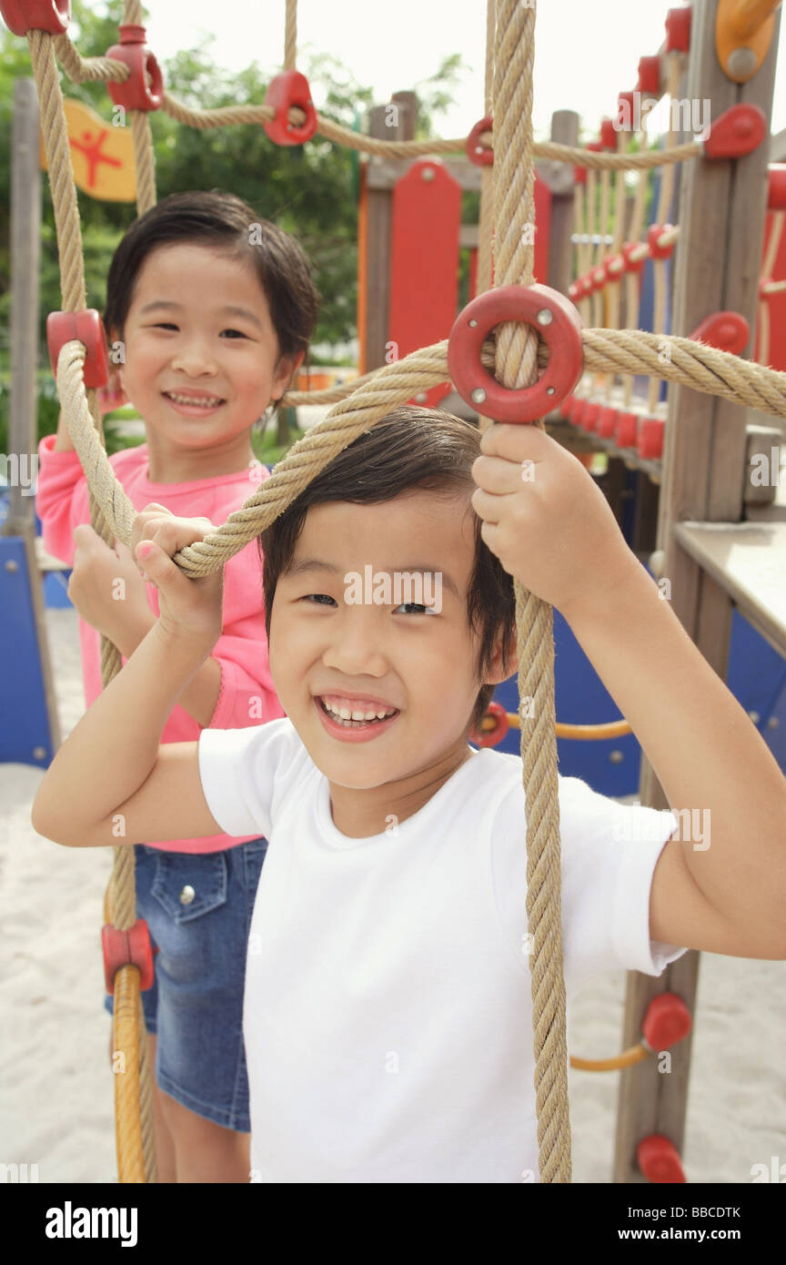 Two girls in playground, looking at camera Stock Photo - Alamy