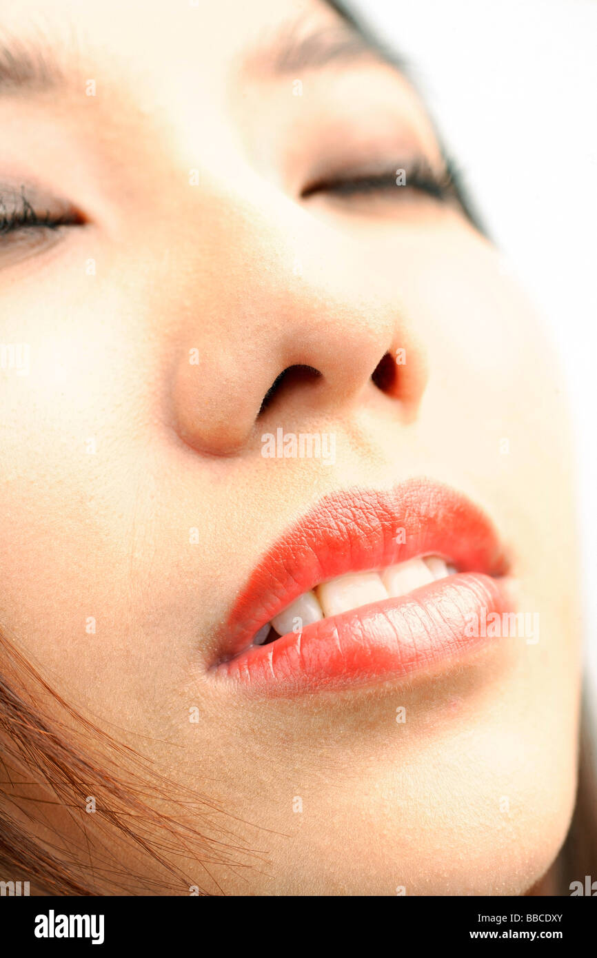 Close up of woman's face, eyes closed Stock Photo - Alamy