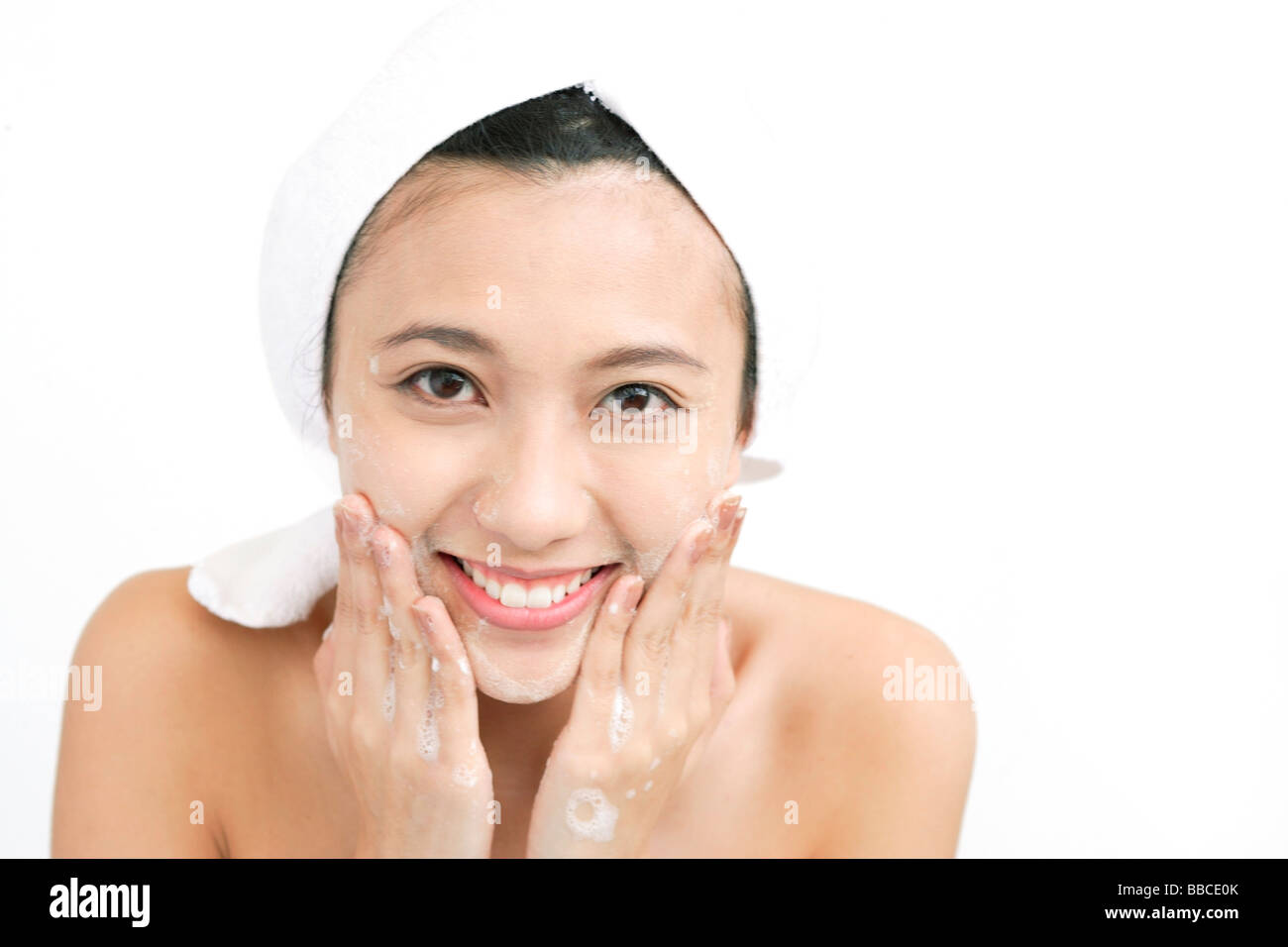 Woman washing face smiling camera hi-res stock photography and images ...