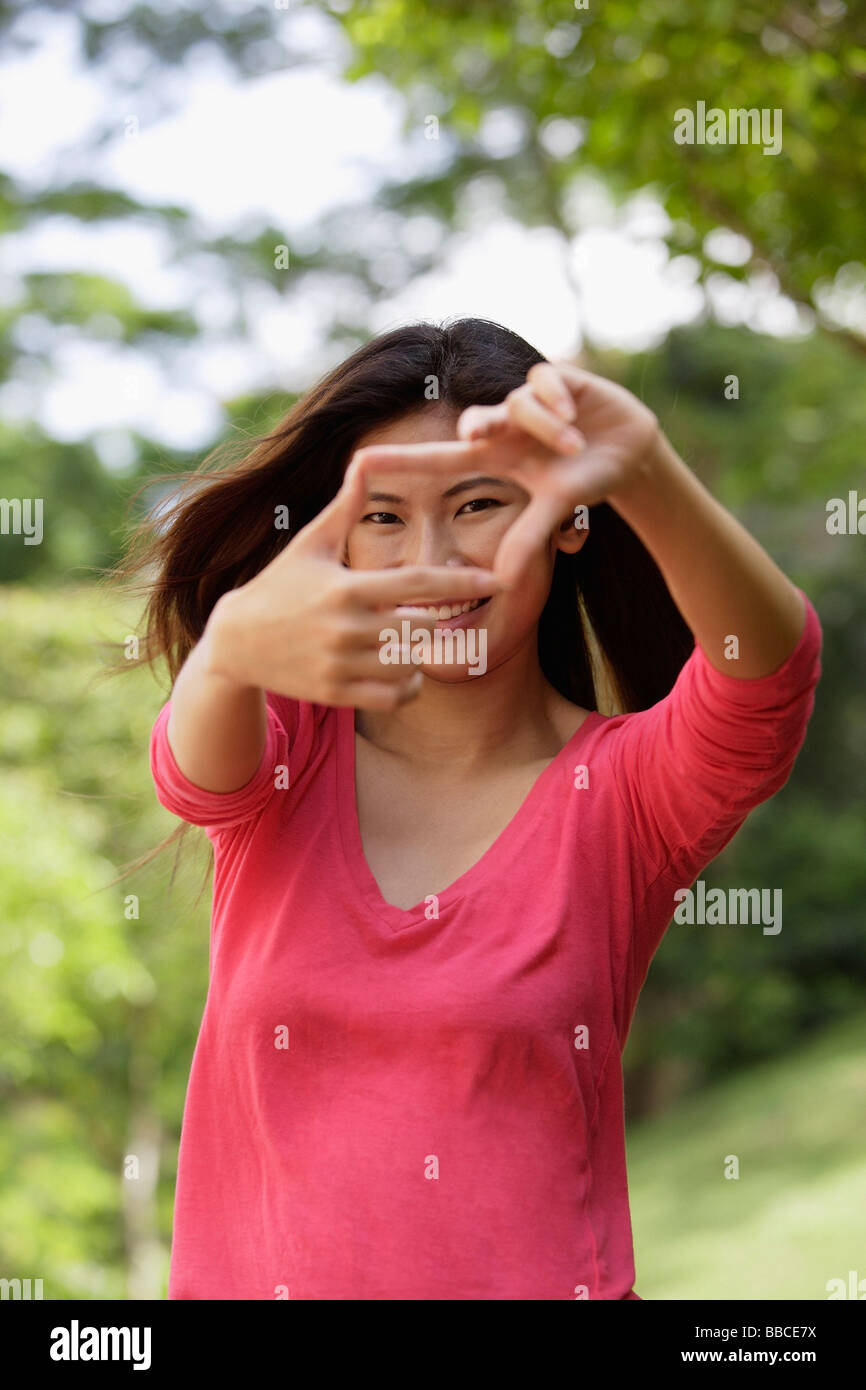 Woman making hand gesture Stock Photo - Alamy