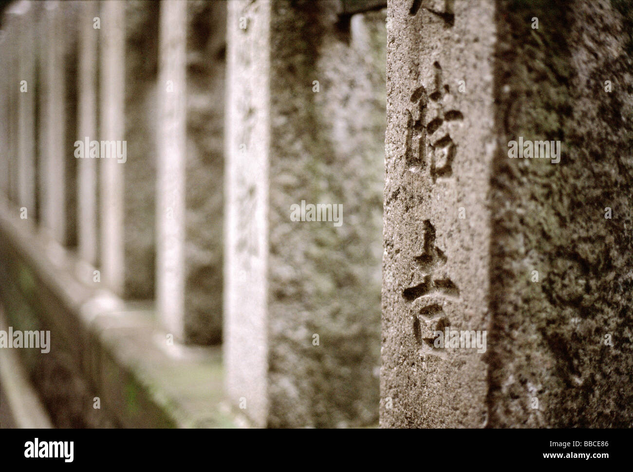 Stones with Japanese text, prayers Stock Photo - Alamy