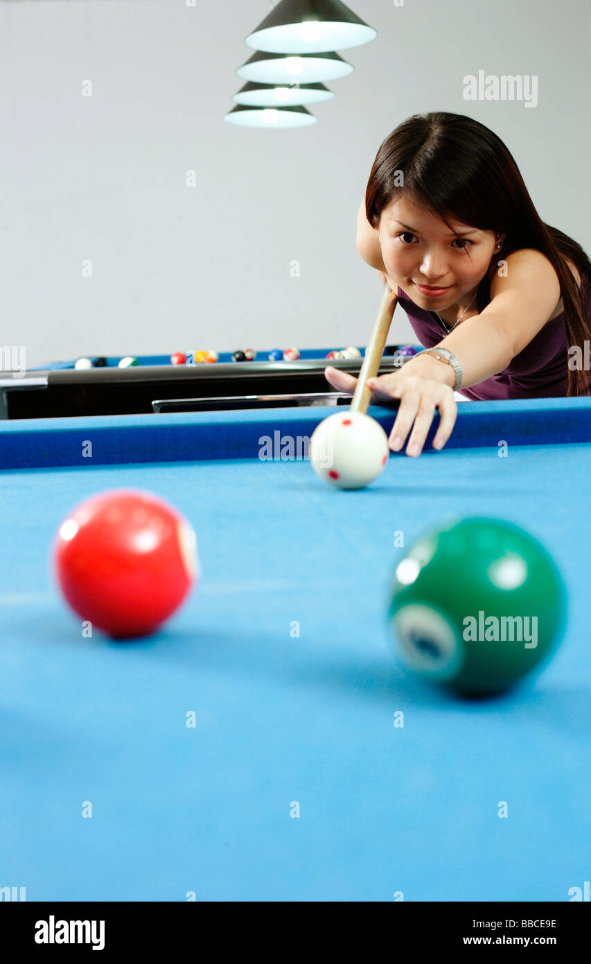 Woman holding pool cue hi-res stock photography and images - Alamy